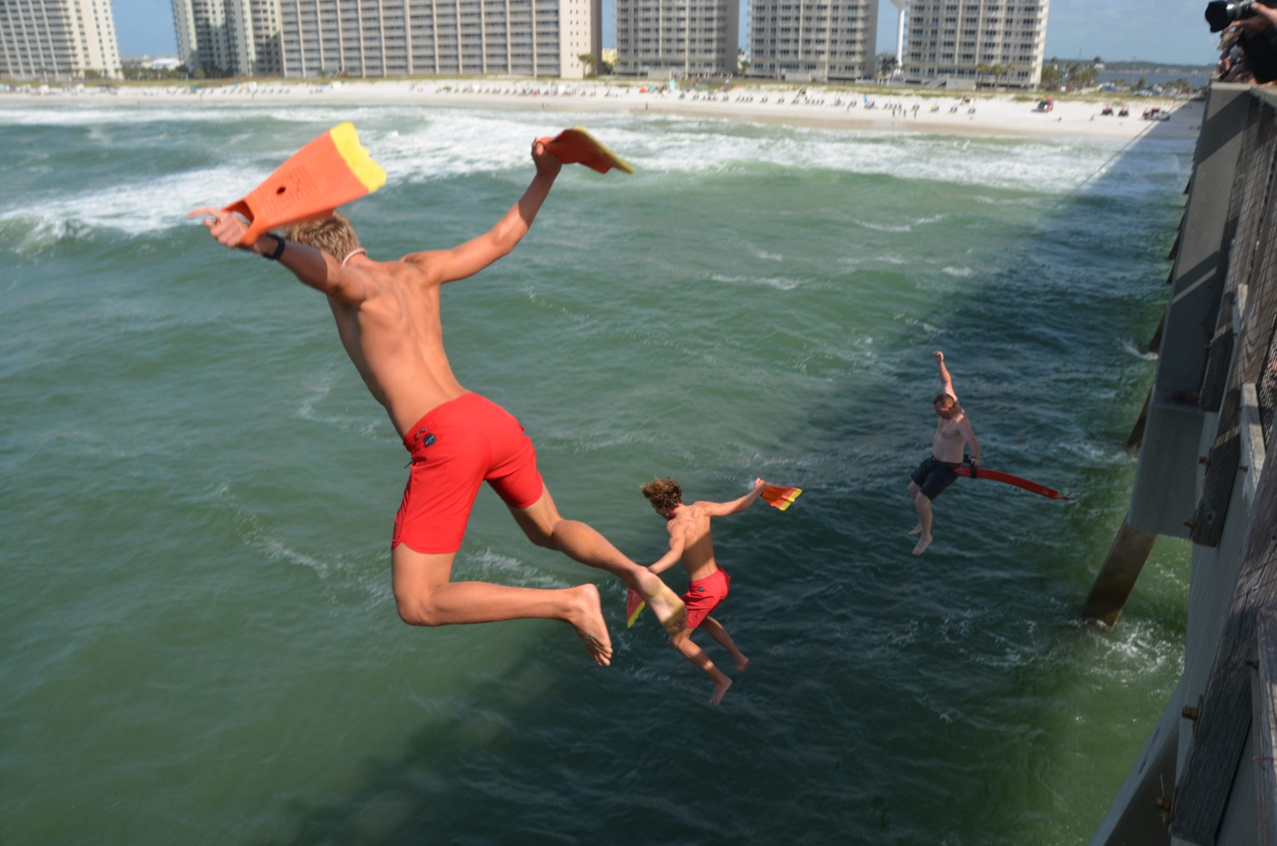 Lifeguards jump 30 feet off pier to complete training | Navarre Press