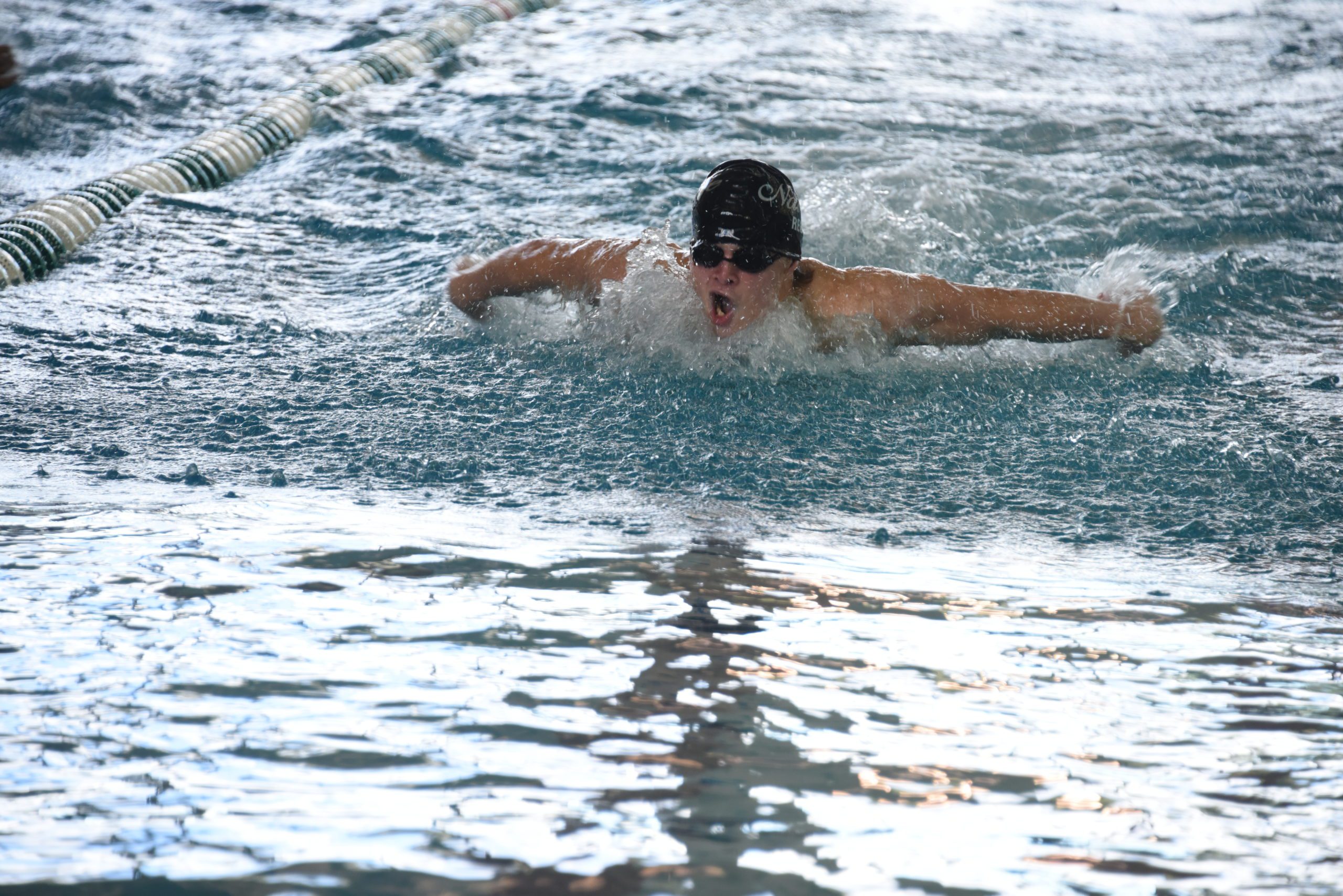 Reed sets school record in 100 Butterfly | Navarre Press