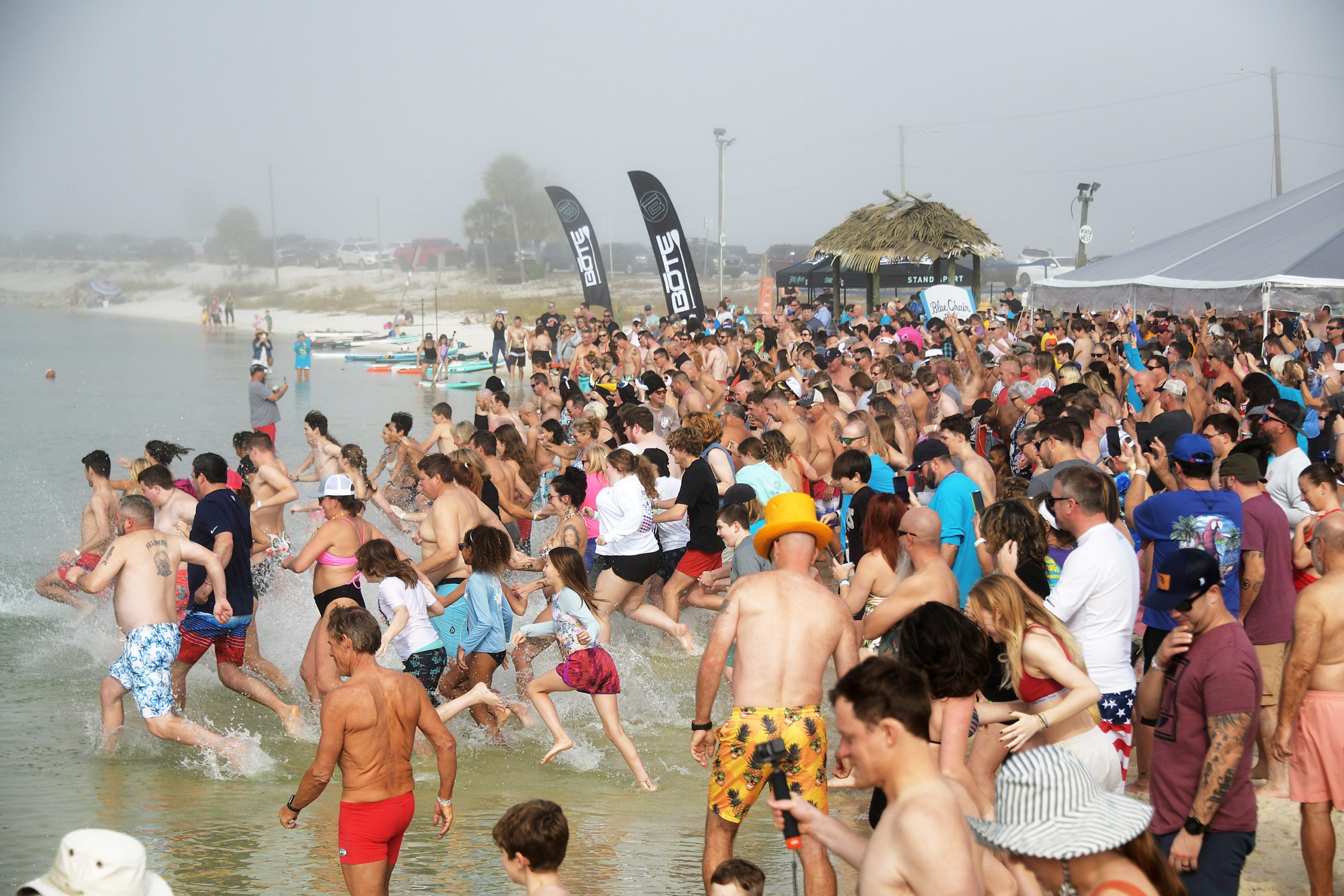 Navarre residents brave winter waters for 14th annual Penguin Plunge | Navarre Press